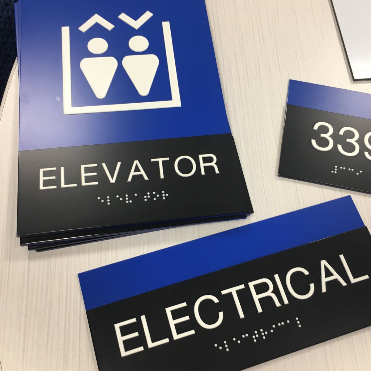 Designer ADA Signs with Braille, Bold Blue, Black and White - Nap ADA ...